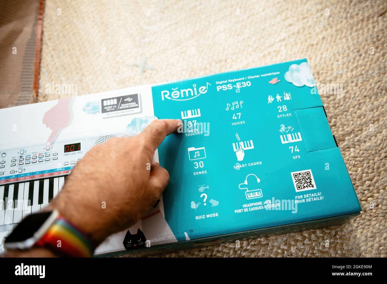 POV male hand pointing to 37 keys signs on new Yamaha Remie digital ...