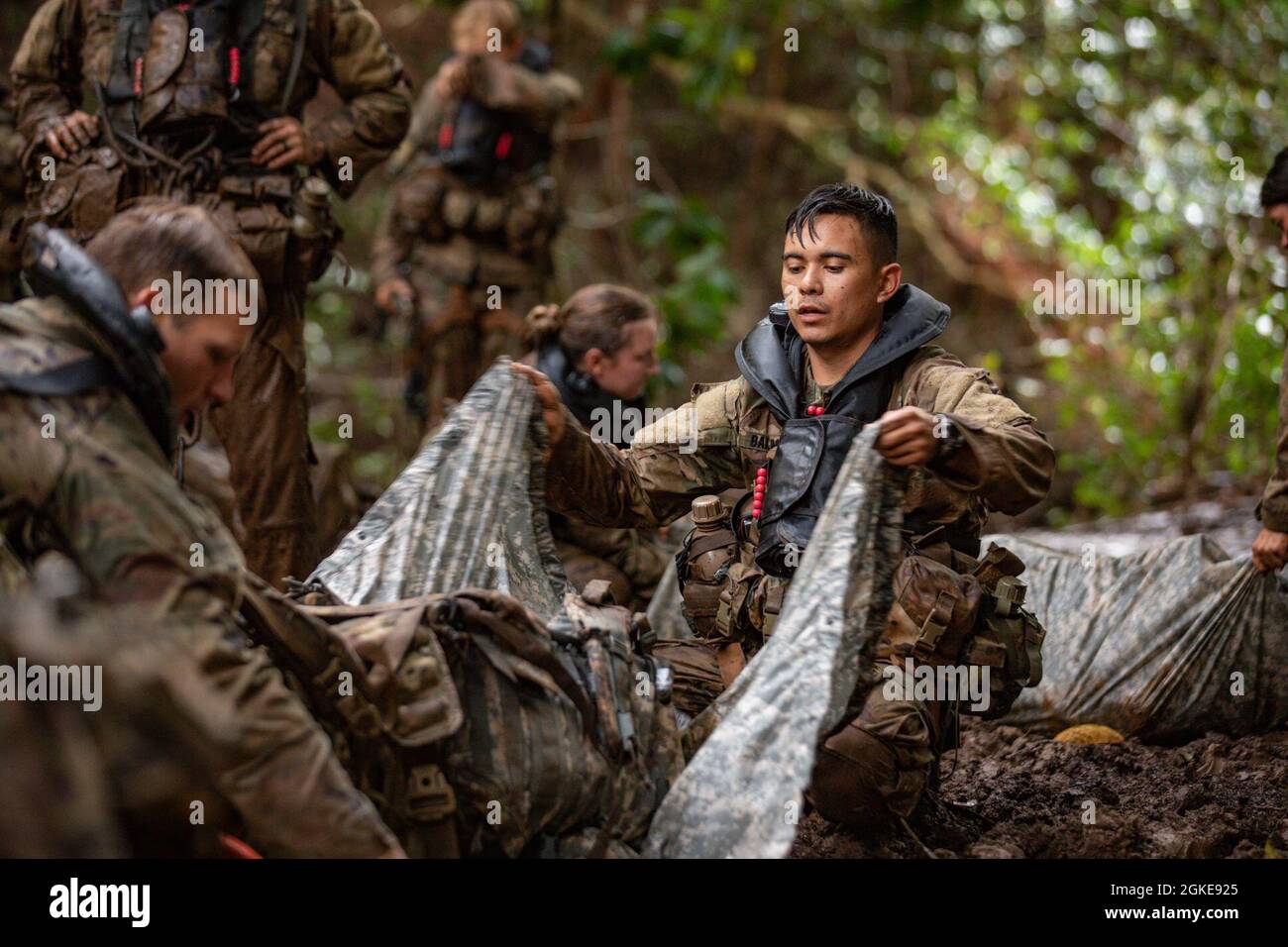 U.S. Army Jungle School Students prepare their ruck raft in order to ...