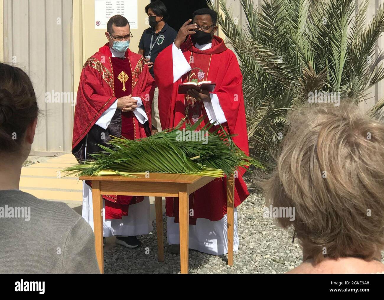 Catholic chaplains Father Angel Anaya and Father Dilio Onyejiuwa bless ...