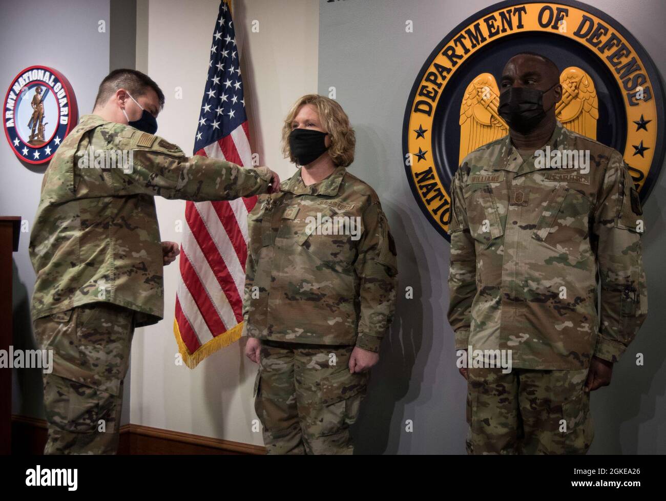 U.S. Air Force Lt. Col. Brian H. Finnerty pins the Legion of Merit onto ...