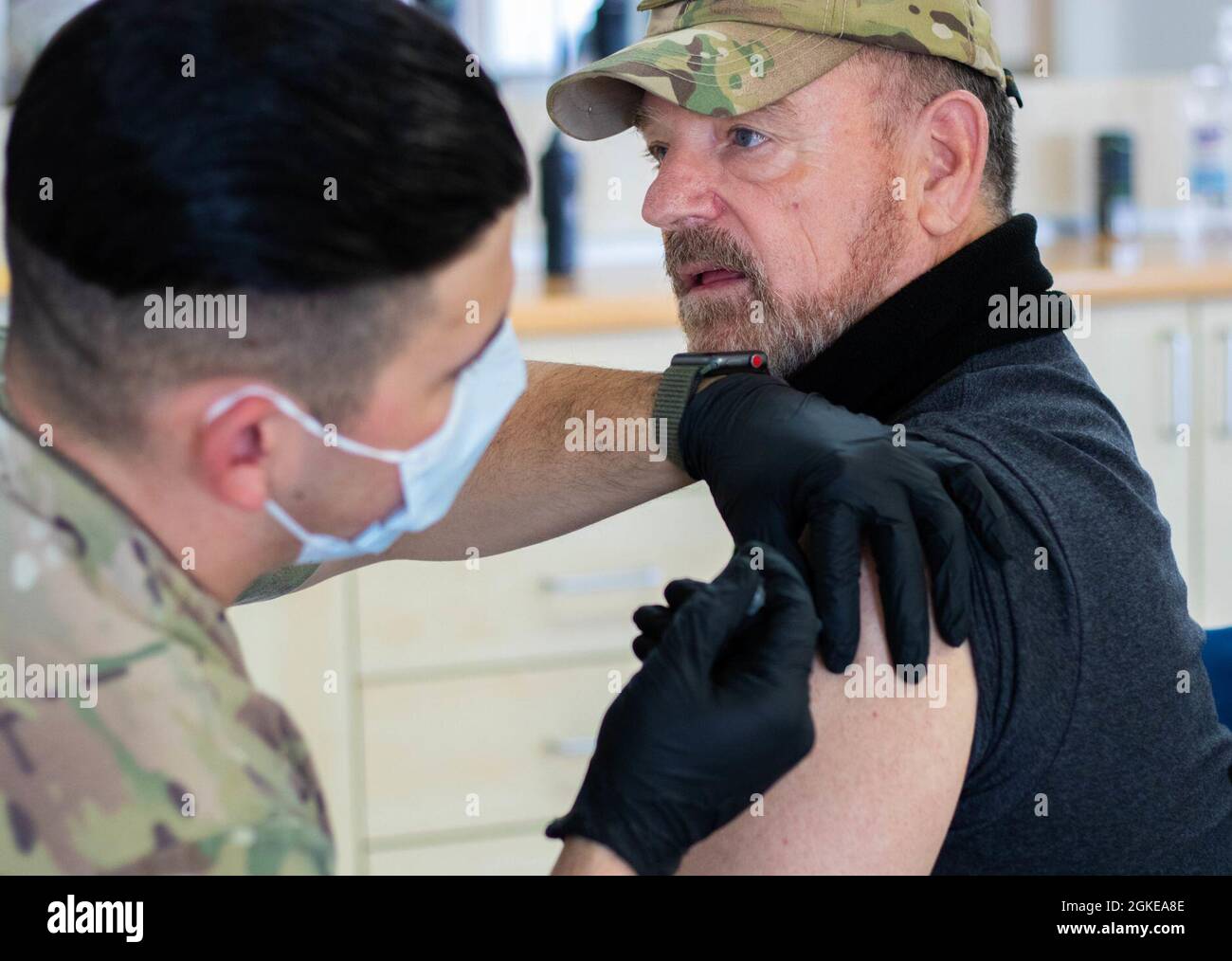 Gordon Pullen, a security contractor working for Kosovo Force, receives ...