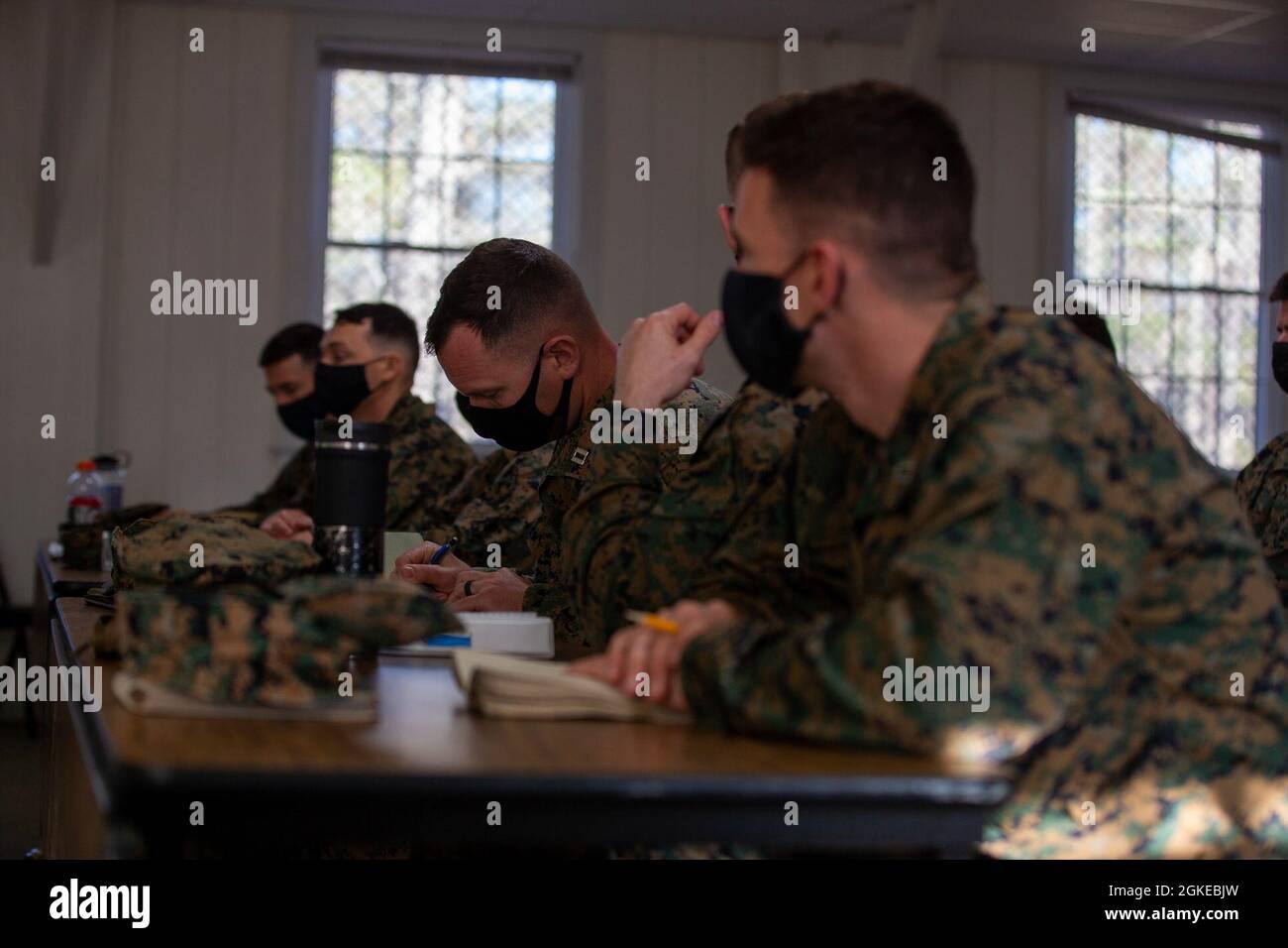 U.S. Marines with 2d Marine Division attend an after action brief ...