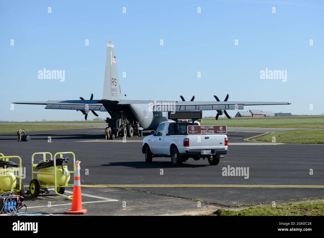 U.S. Airmen assigned to the 86th Airlift Wing load a C-130J Super ...