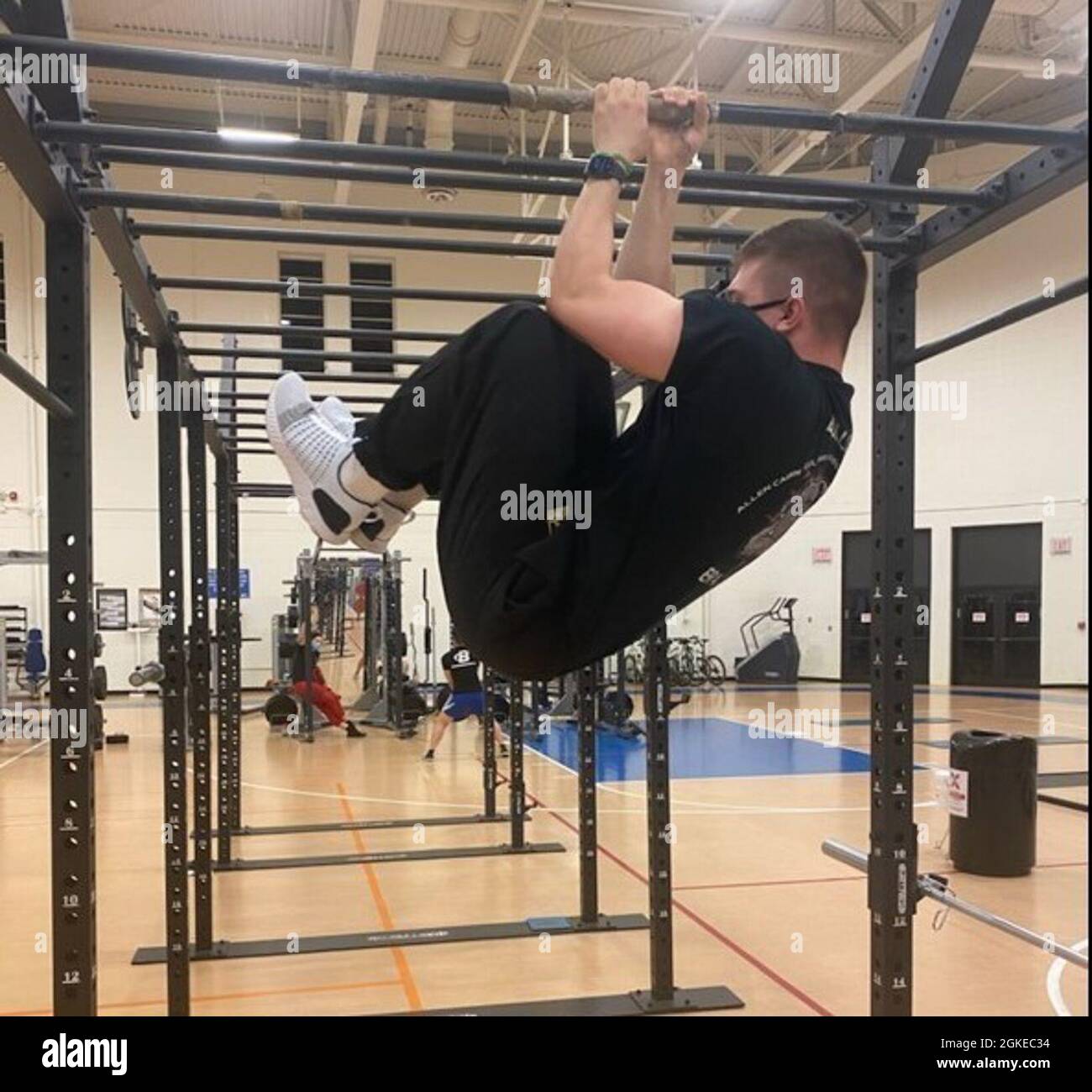 Army Staff Sgt. Brandon Avlonitis demonstrates the proper leg tuck form ...