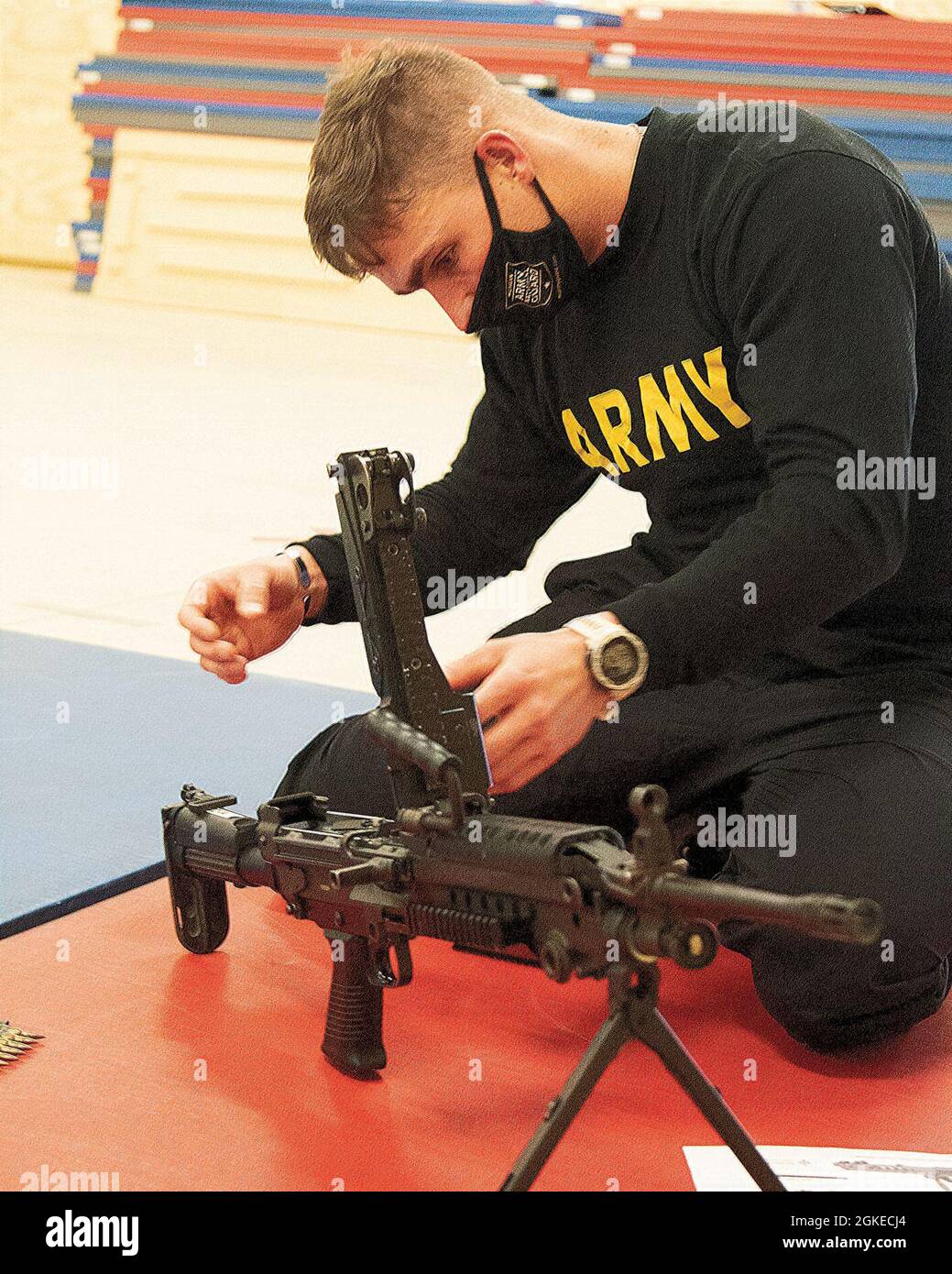 A Michigan Army National Guard soldier dismantles and reassembles a ...