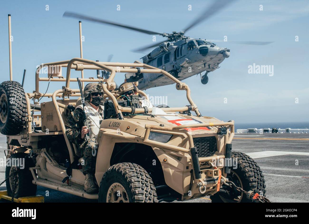 PACIFIC OCEAN (March 29, 2021) U.S. Marine Corps Sgt. Tyler Roup, left ...