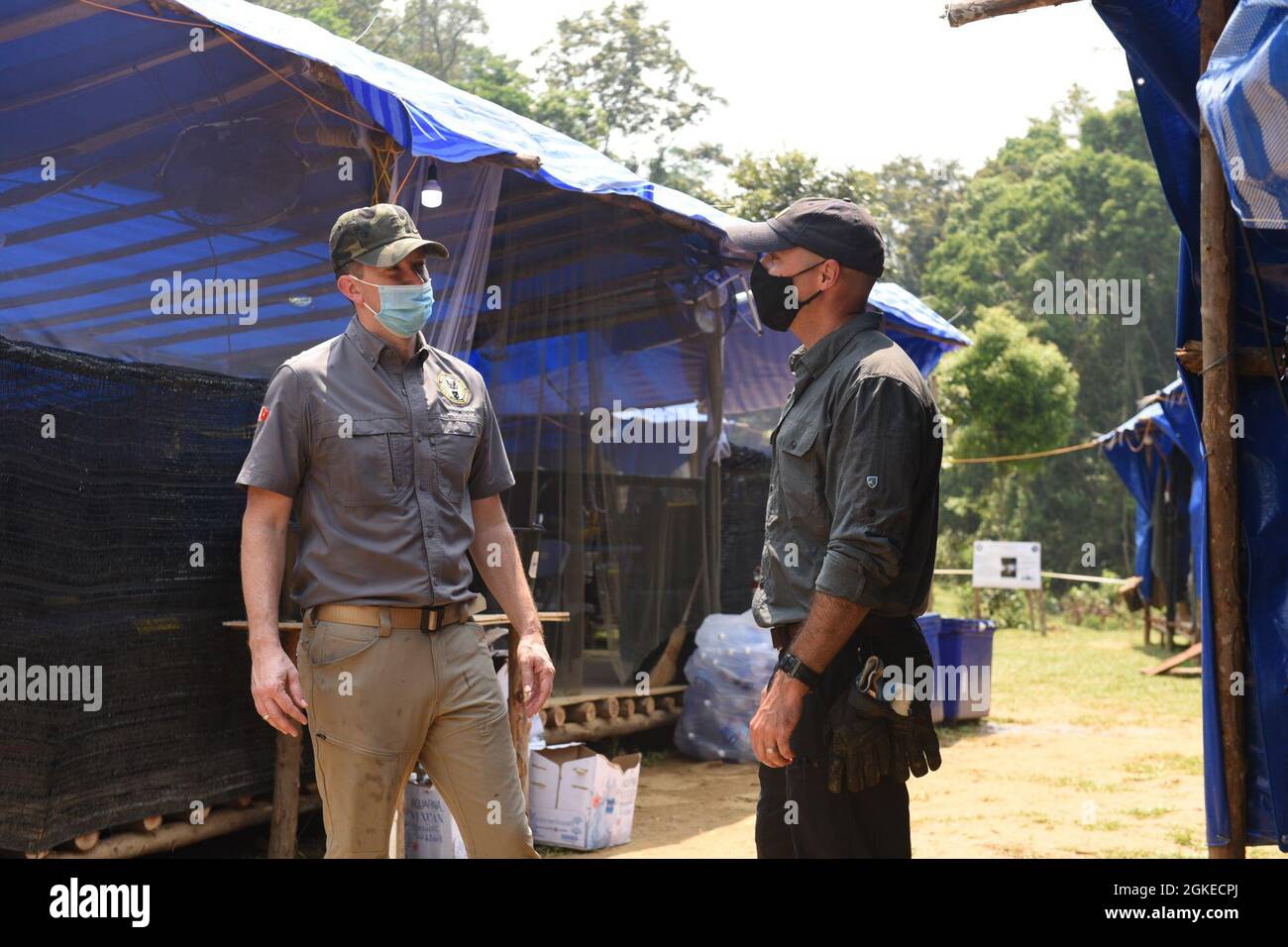 From left, Defense POW/MIA Accounting Agency (DPAA) Detachment 2 ...