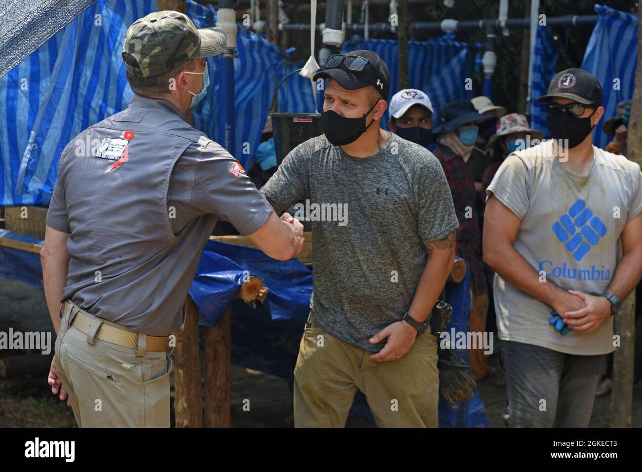 From left, Defense POW/MIA Accounting Agency (DPAA) Detachment 2 ...