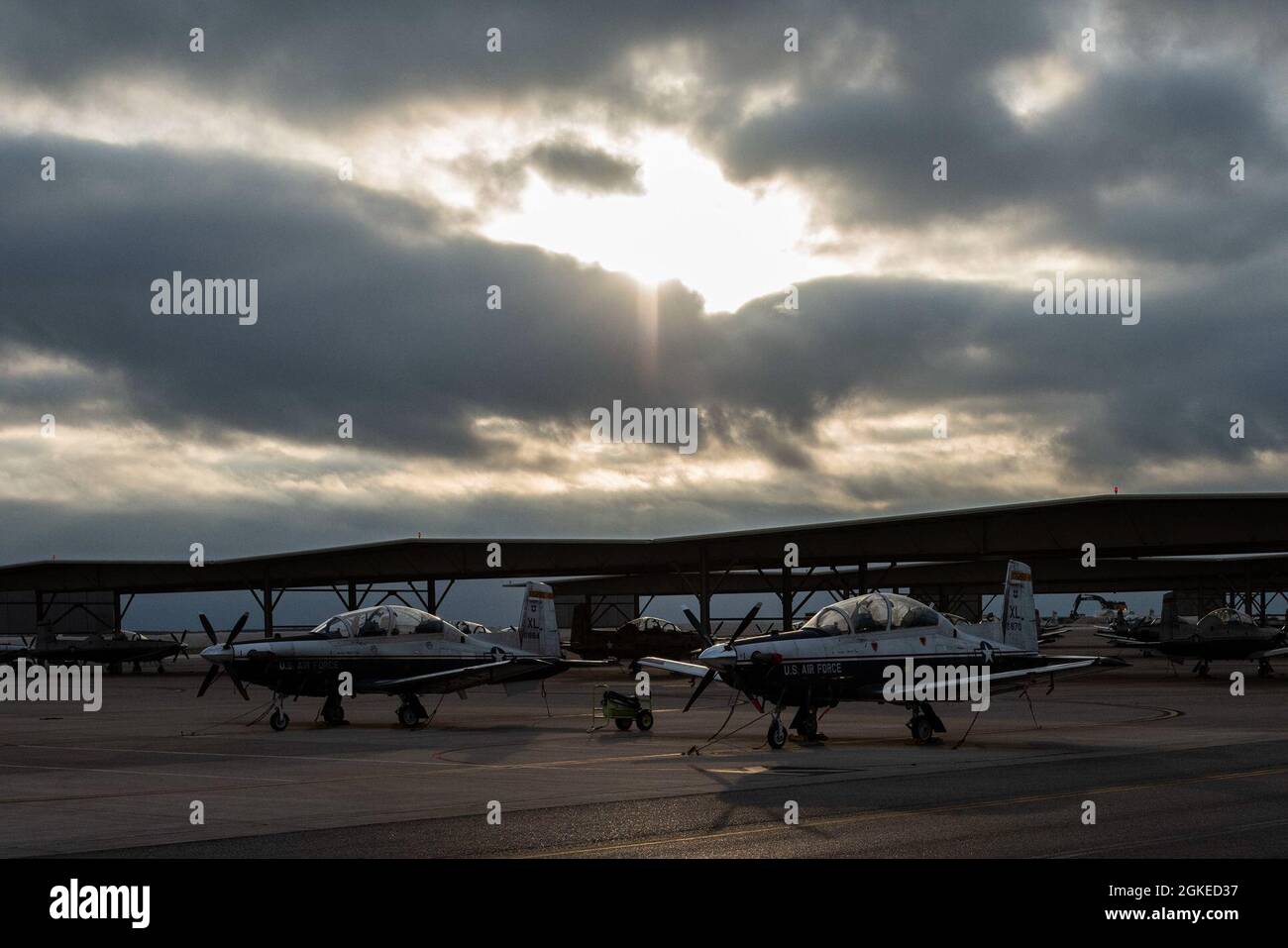 A group of T-6s stand by on the flight line awaiting the first flight ...