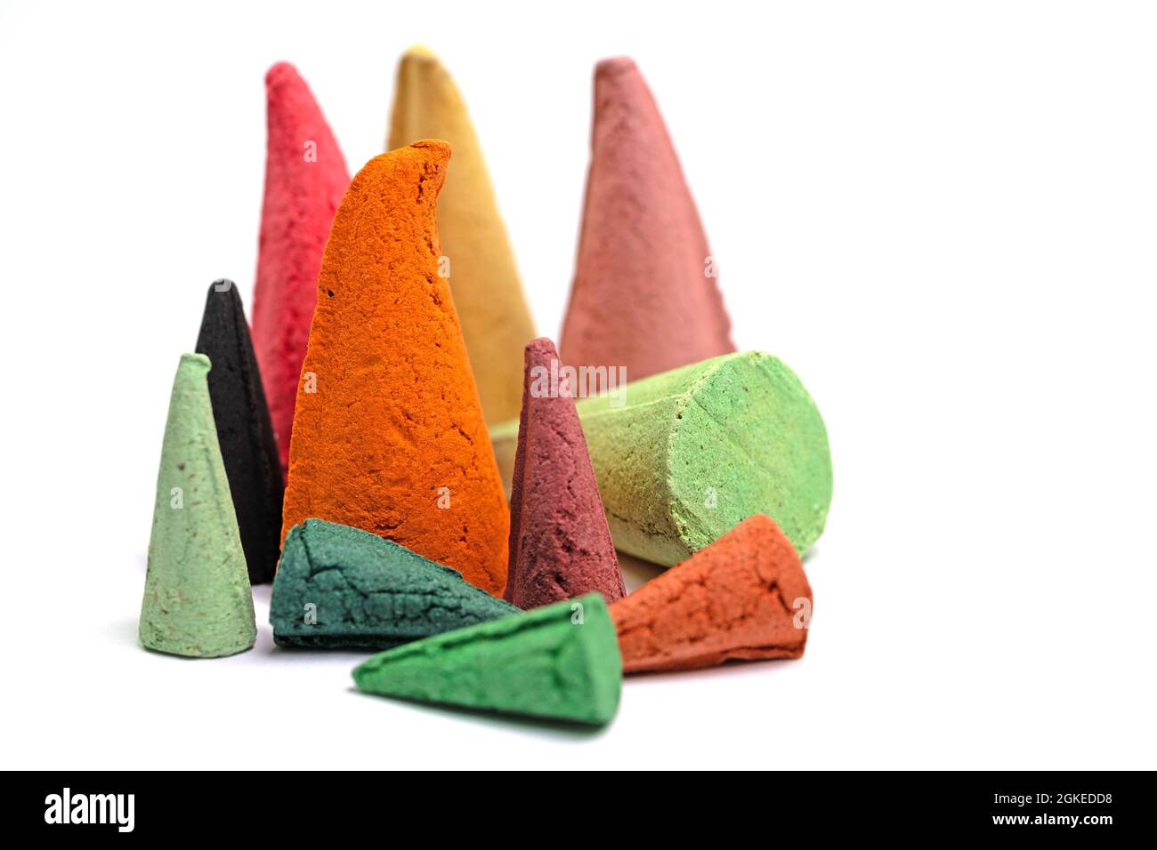 Colorful incense cones against white background Stock Photo - Alamy