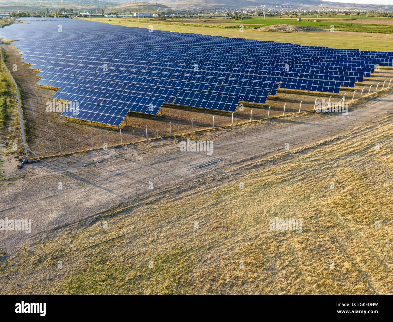 High angle shot of solar panels in a flat landscape on a sunny day ...