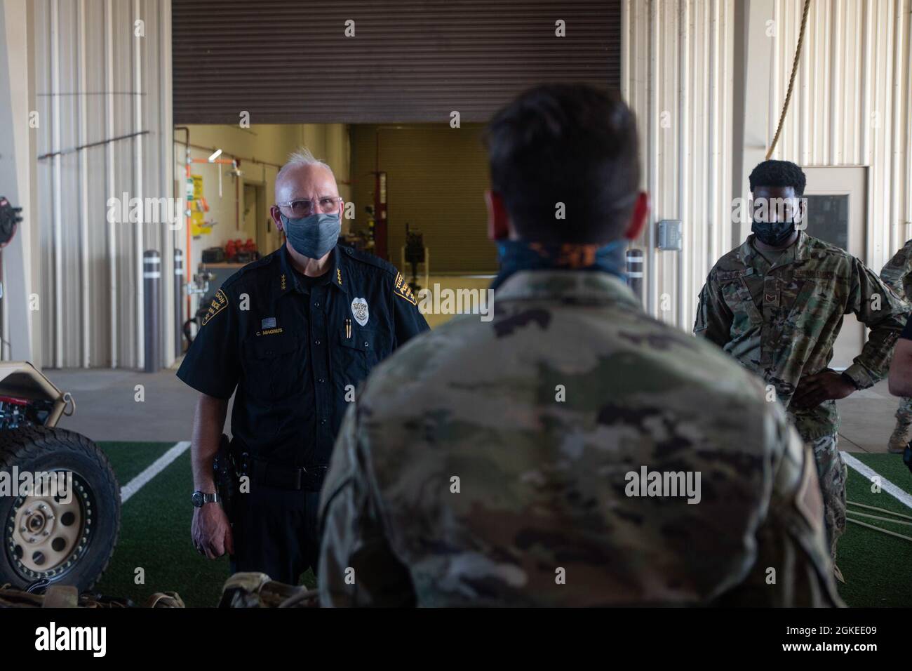 Chris Magnus, chief of the Tucson Police Department, interacts with an ...