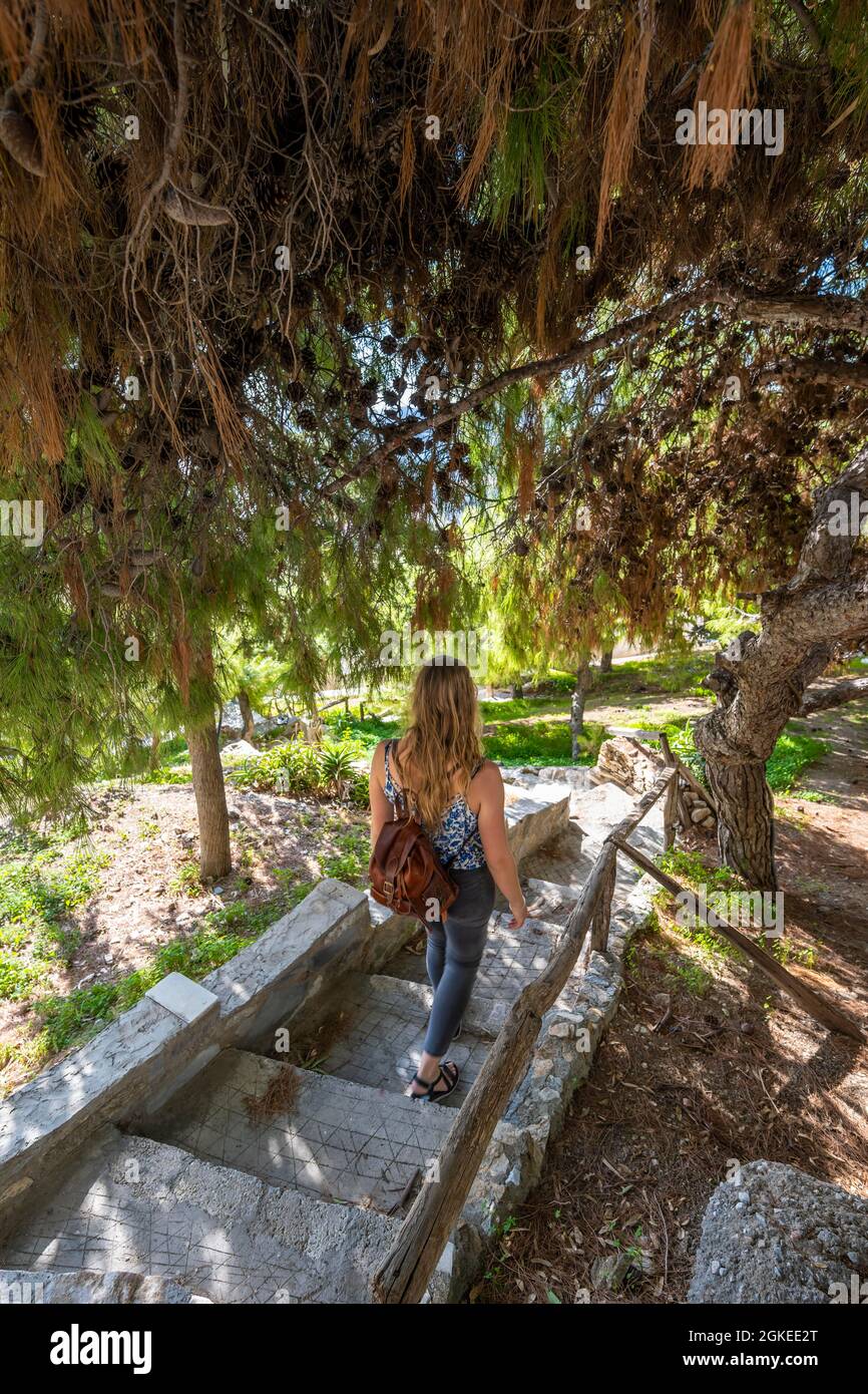 Young woman on the steps of the hill of Ano Syros, Syros, Cyclades ...