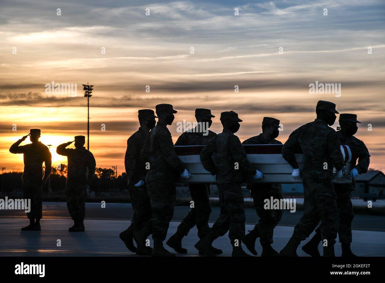 A U.S. Air Force carry team carries a training transfer case during Air ...