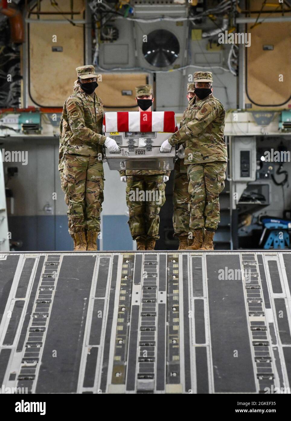 A U.S. Air Force carry team carries a training transfer case during Air ...