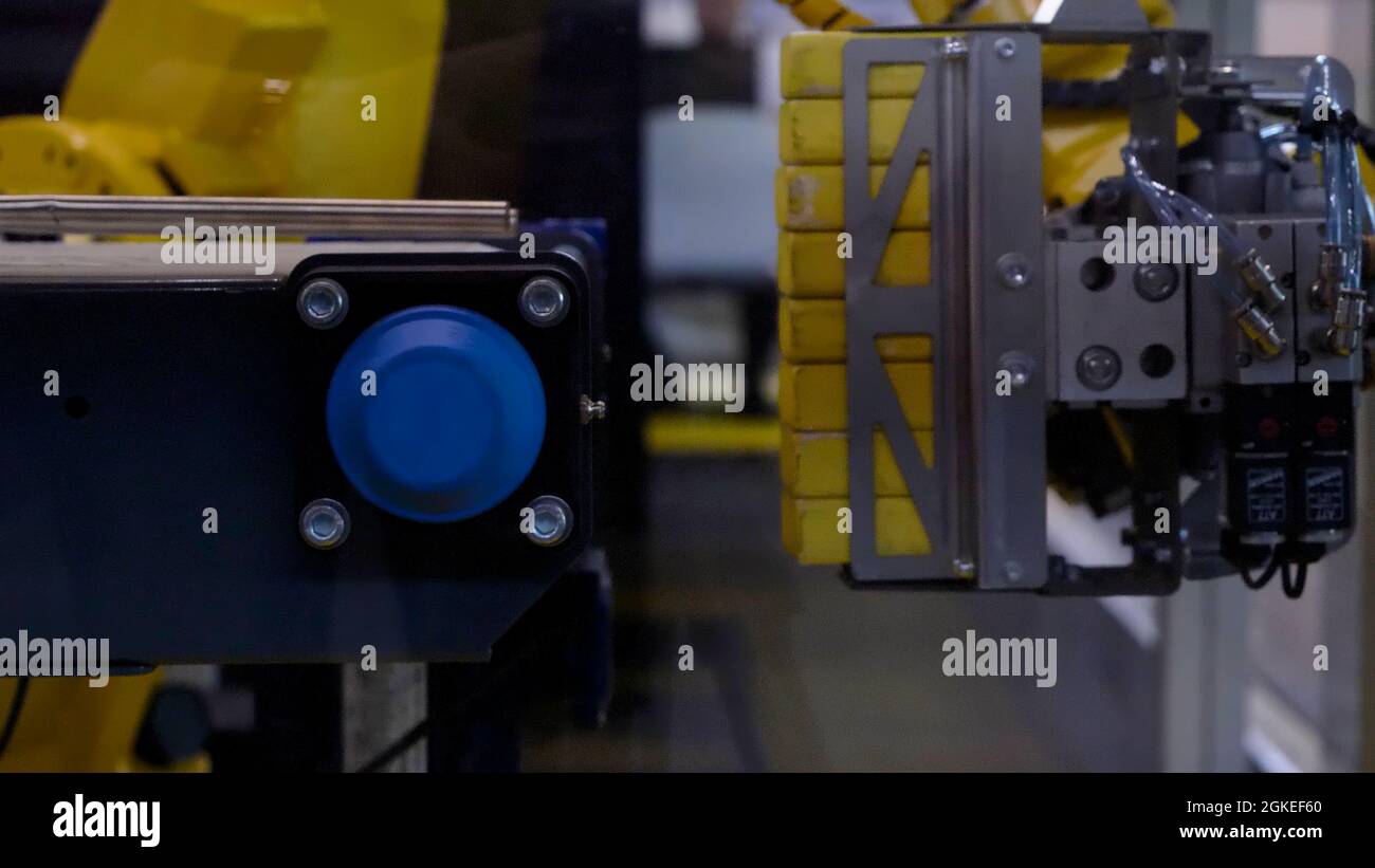 Commercial production concept, robotic automated equipment in action ...