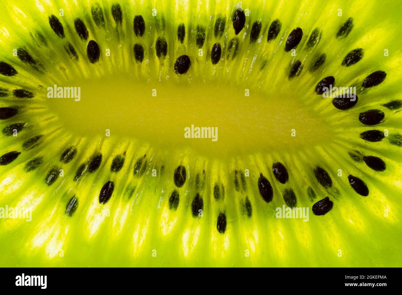 ripe kiwi - cross-section of the fruit, macro close-up Stock Photo - Alamy