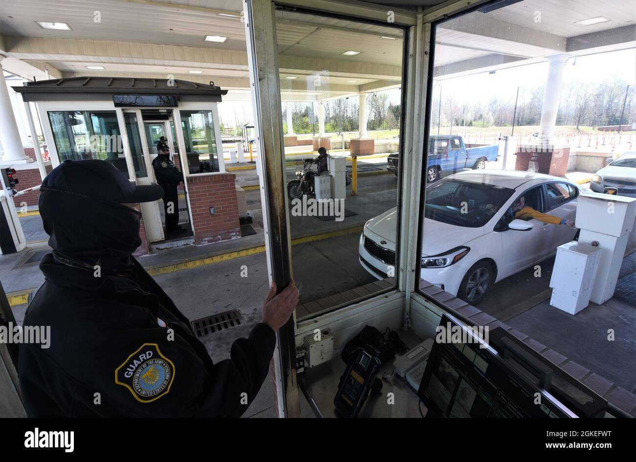 Several motorists pass enter Fort Knox at the main entry control point ...