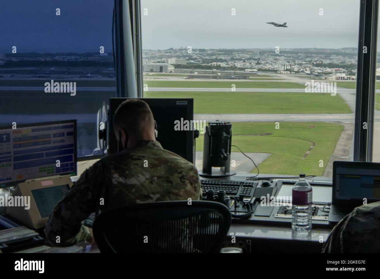 An 18th Operations Support Squadron air traffic controller communicates ...