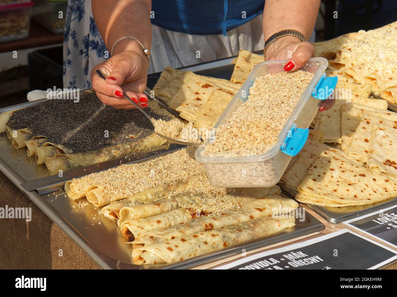 A market stall selling potato pancakes called "lokse". Seller of potato ...