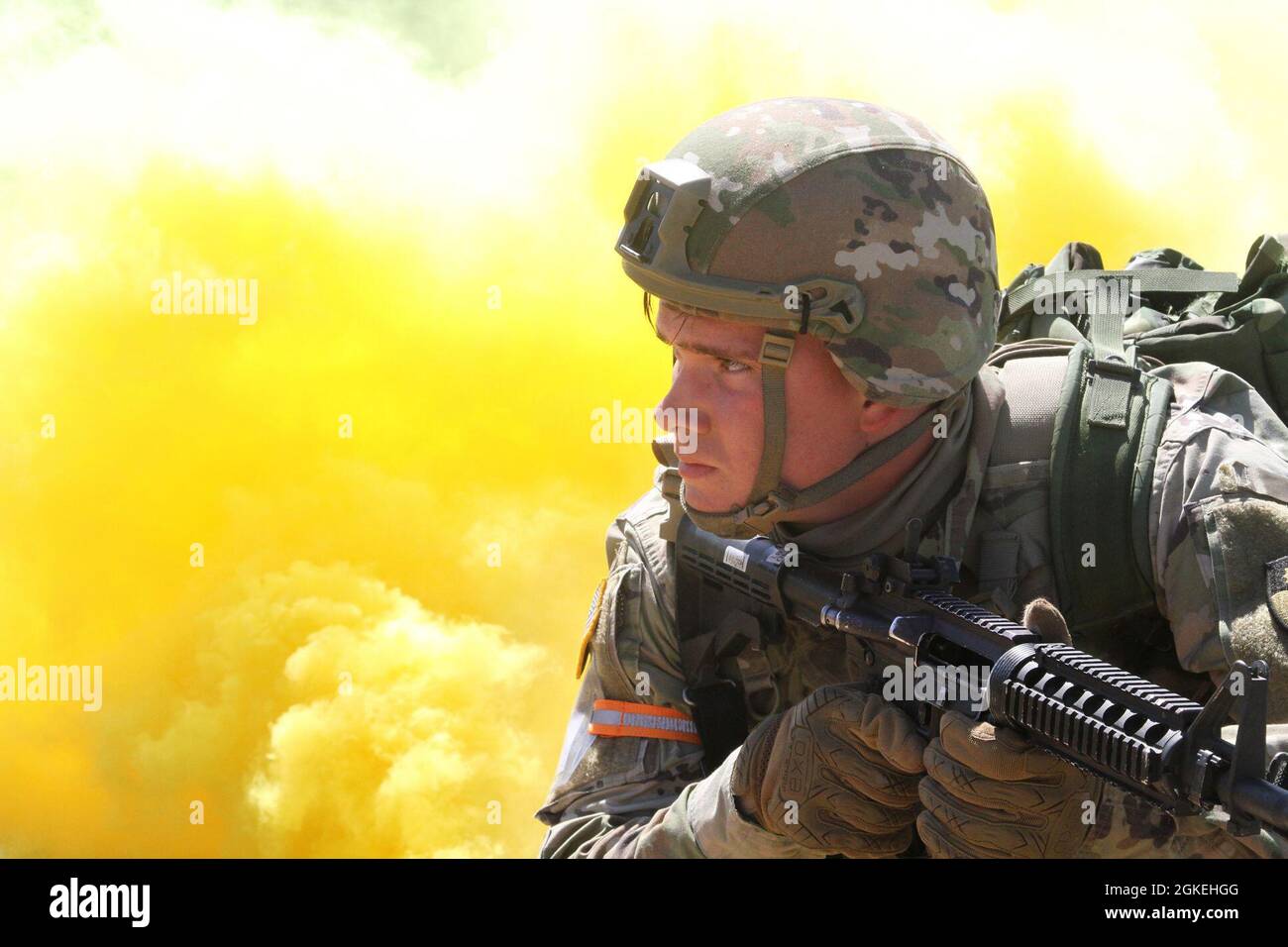 Yellow smoke billows as U.S. Army Spc. Caleb Romero of the California ...