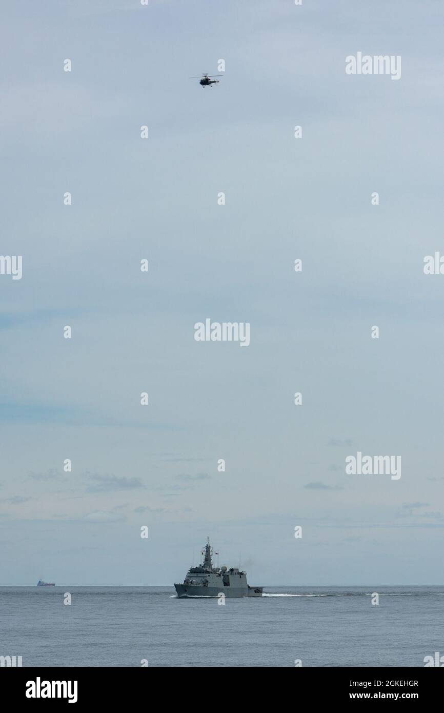 INDIAN OCEAN (March 31, 2021) An Indian Navy Chetak helicopter flies ...