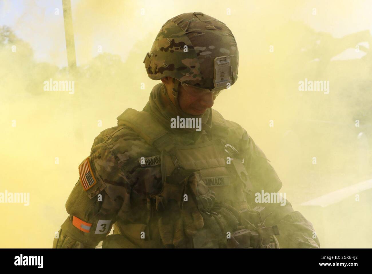 Yellow smoke billows as U.S. Army Spc. Alex Hammack of the California ...