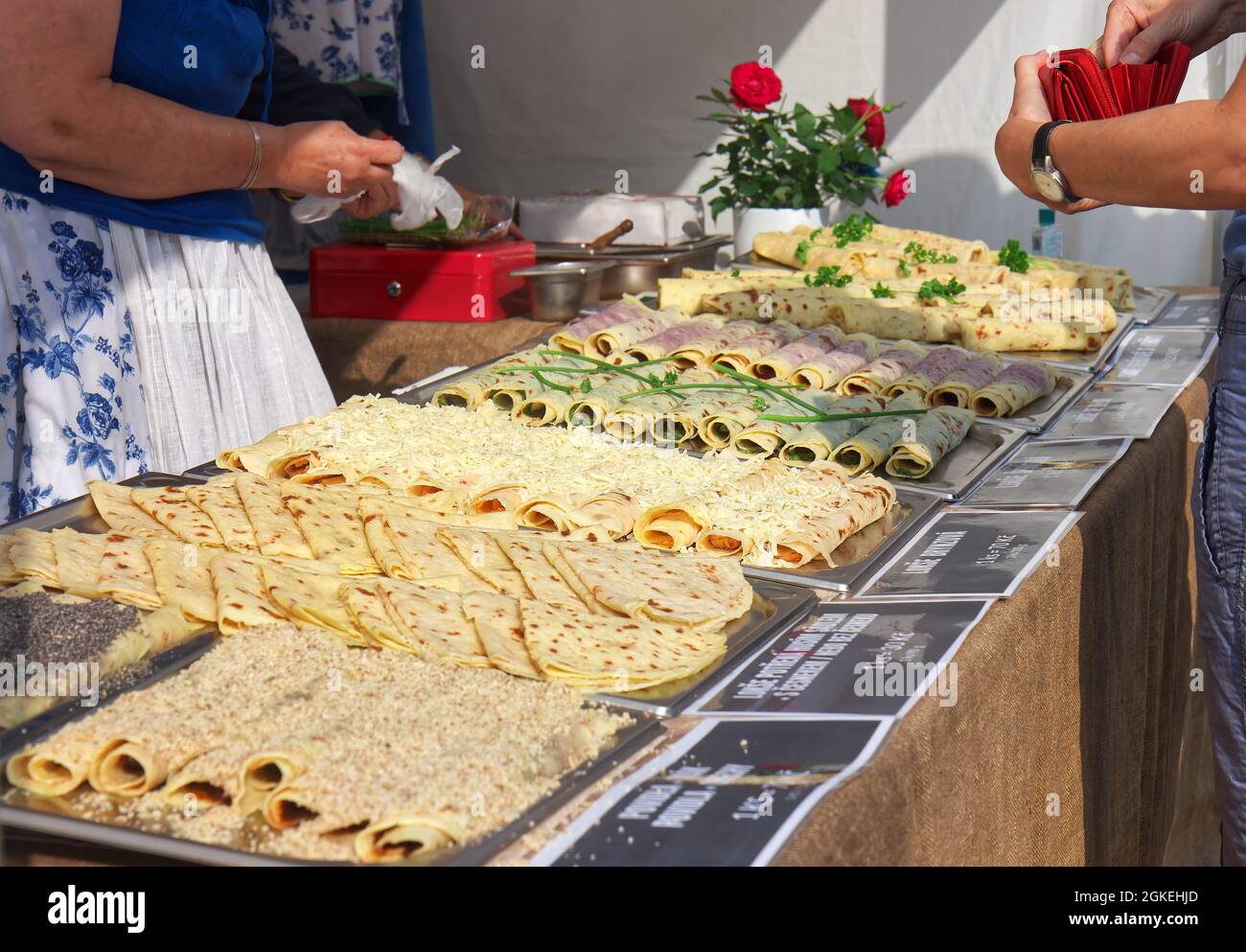 A market stall with sweet and savoury potato pancakes called "lokse". A ...