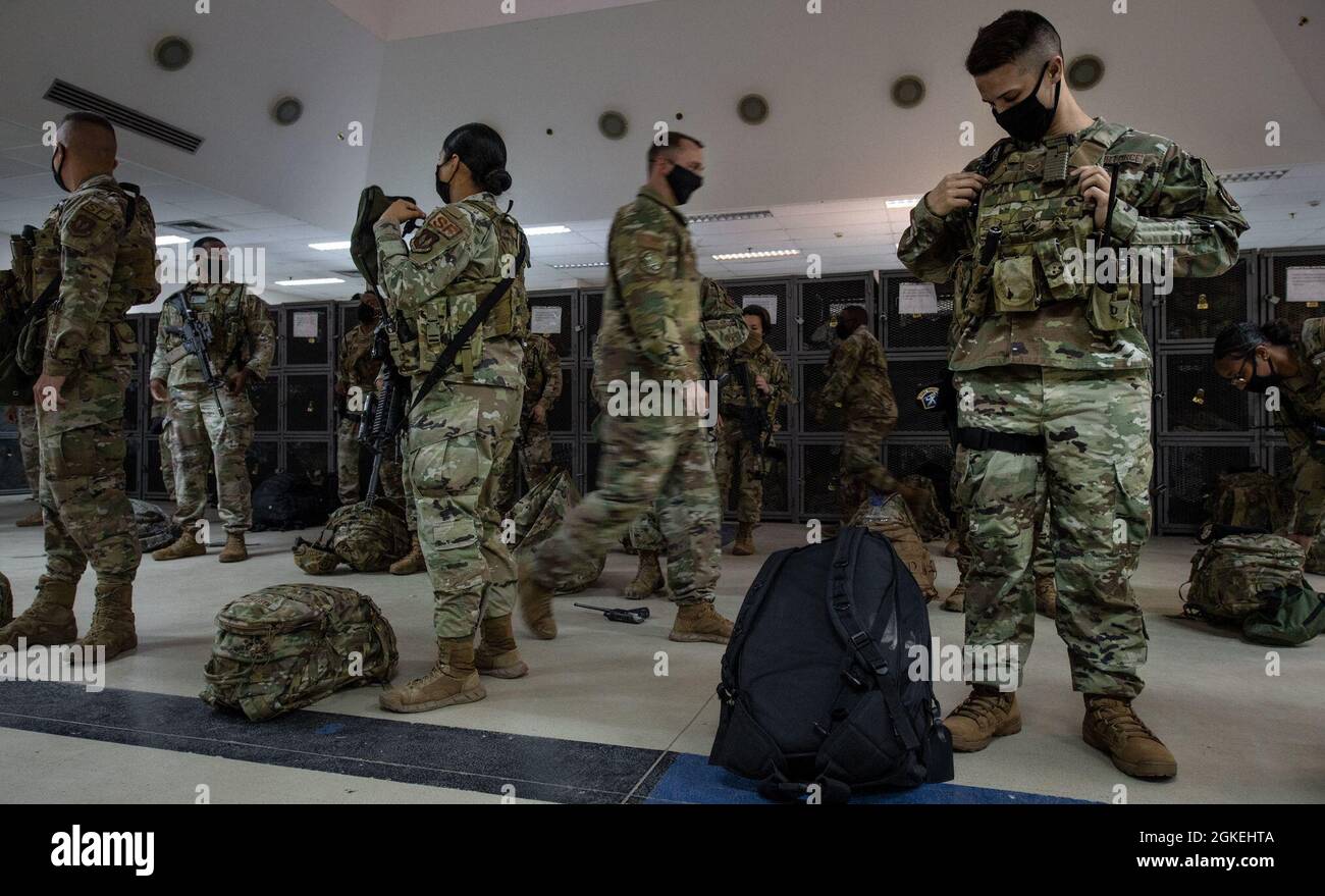 39th Security Forces Squadron patrolmen check their gear during a ...