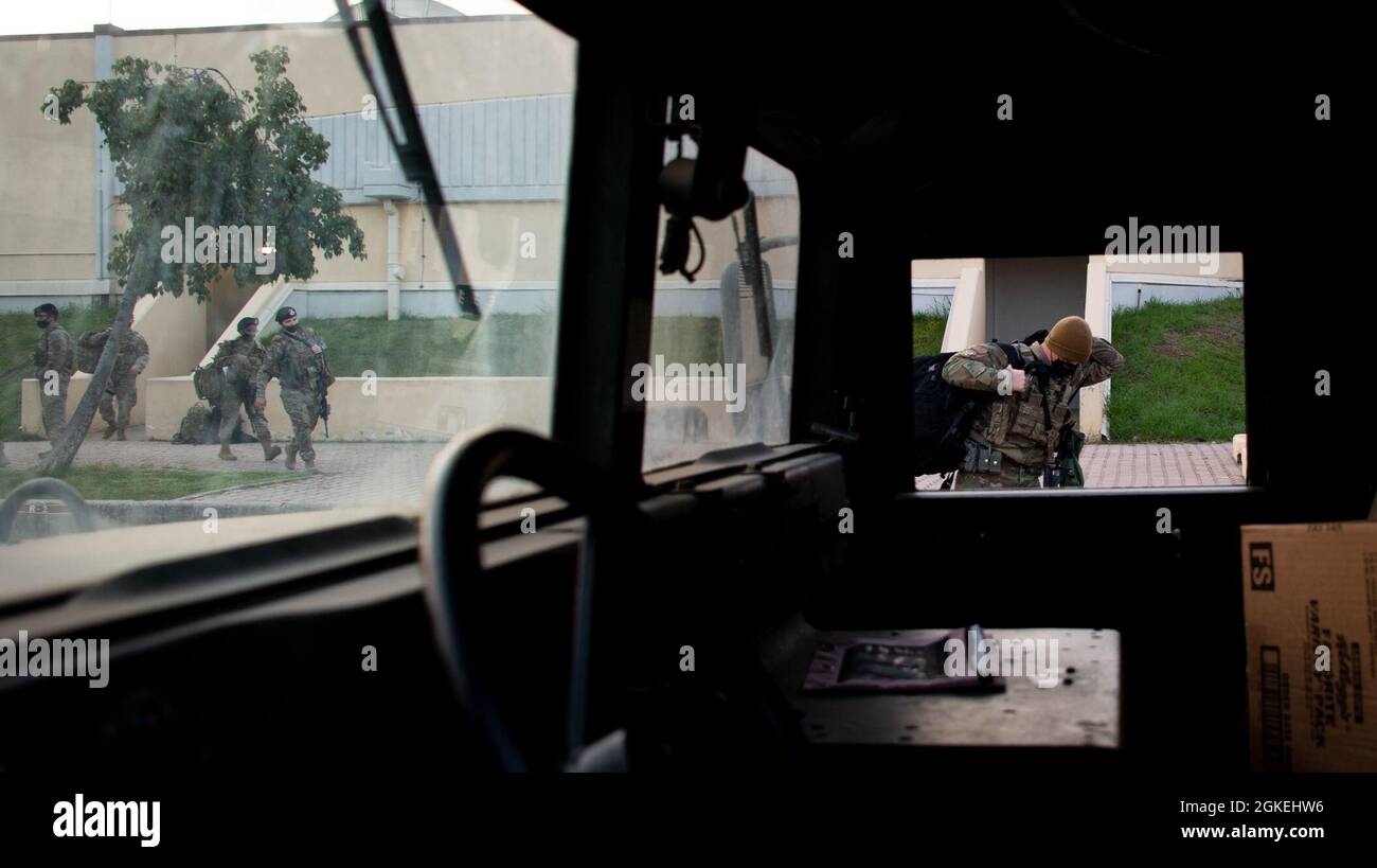 39th Security Forces Squadron patrolmen depart the SFS armory building ...