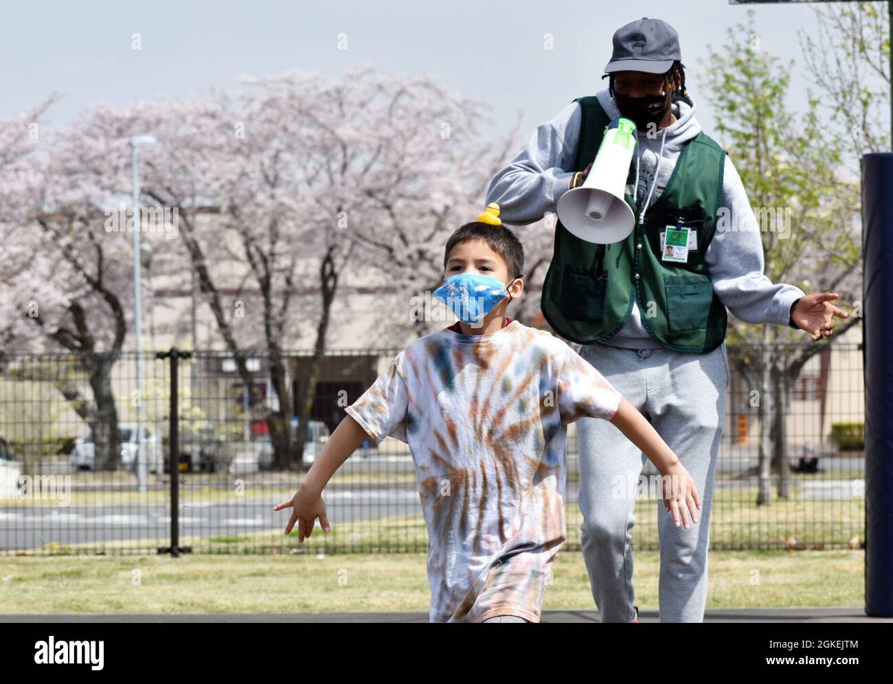 Bruce Crispell, a second-grader, balances a duck on his head during the ...