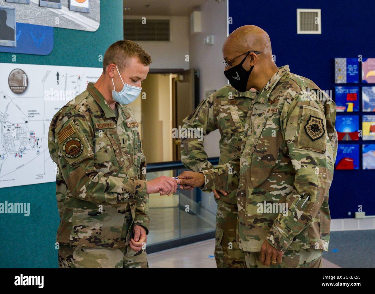 Air Force Chief of Staff Gen. Charles Q. Brown presents a coin to 1st ...