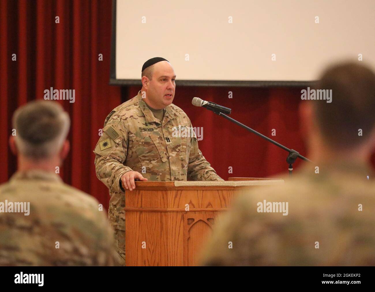 Rabbi David Becker speaks to guests during a Holocaust Remembrance ...