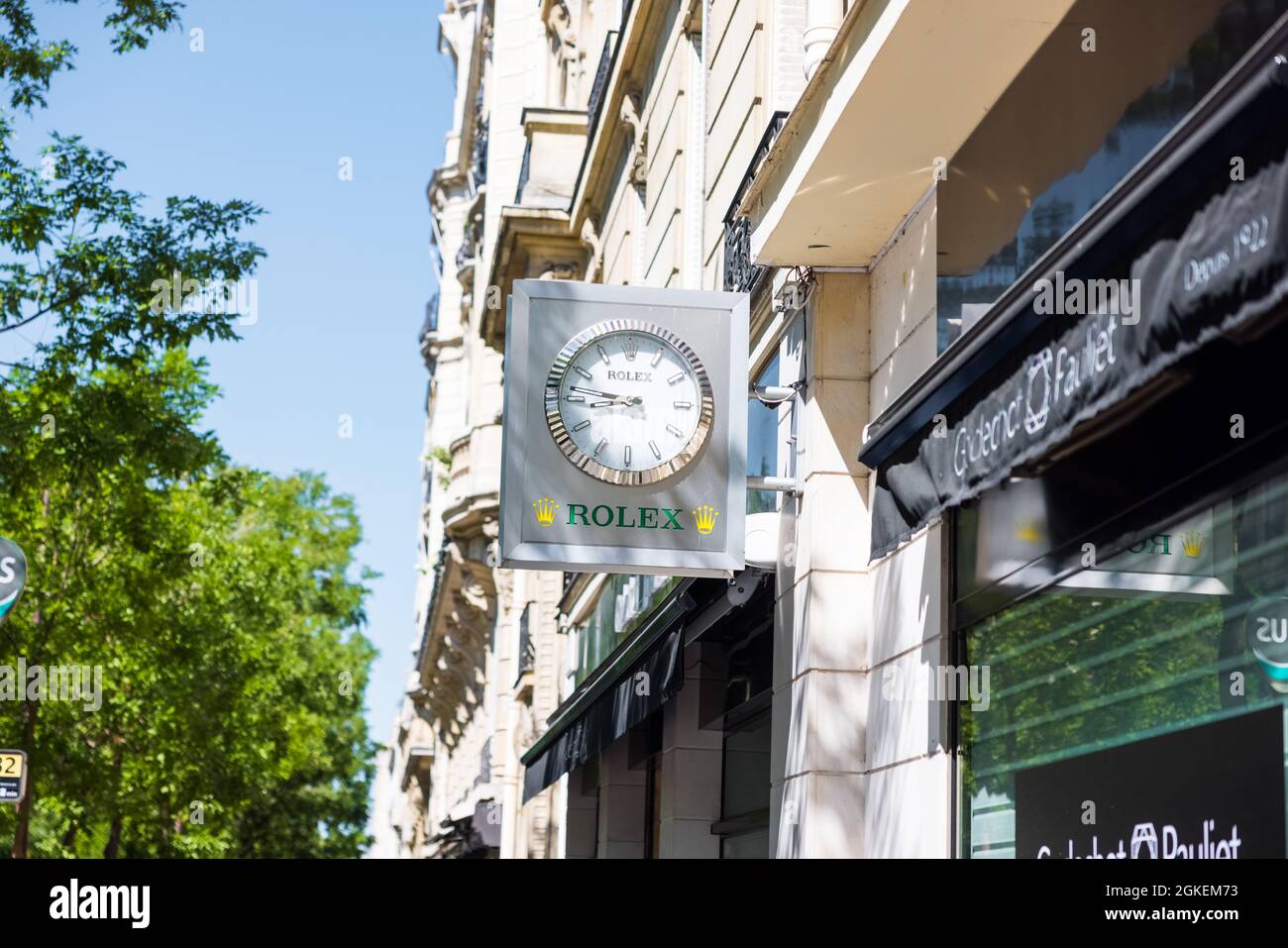 PARIS, FRANCE - Aug 14, 2021: A closeup shot of a Rolex clock in front ...