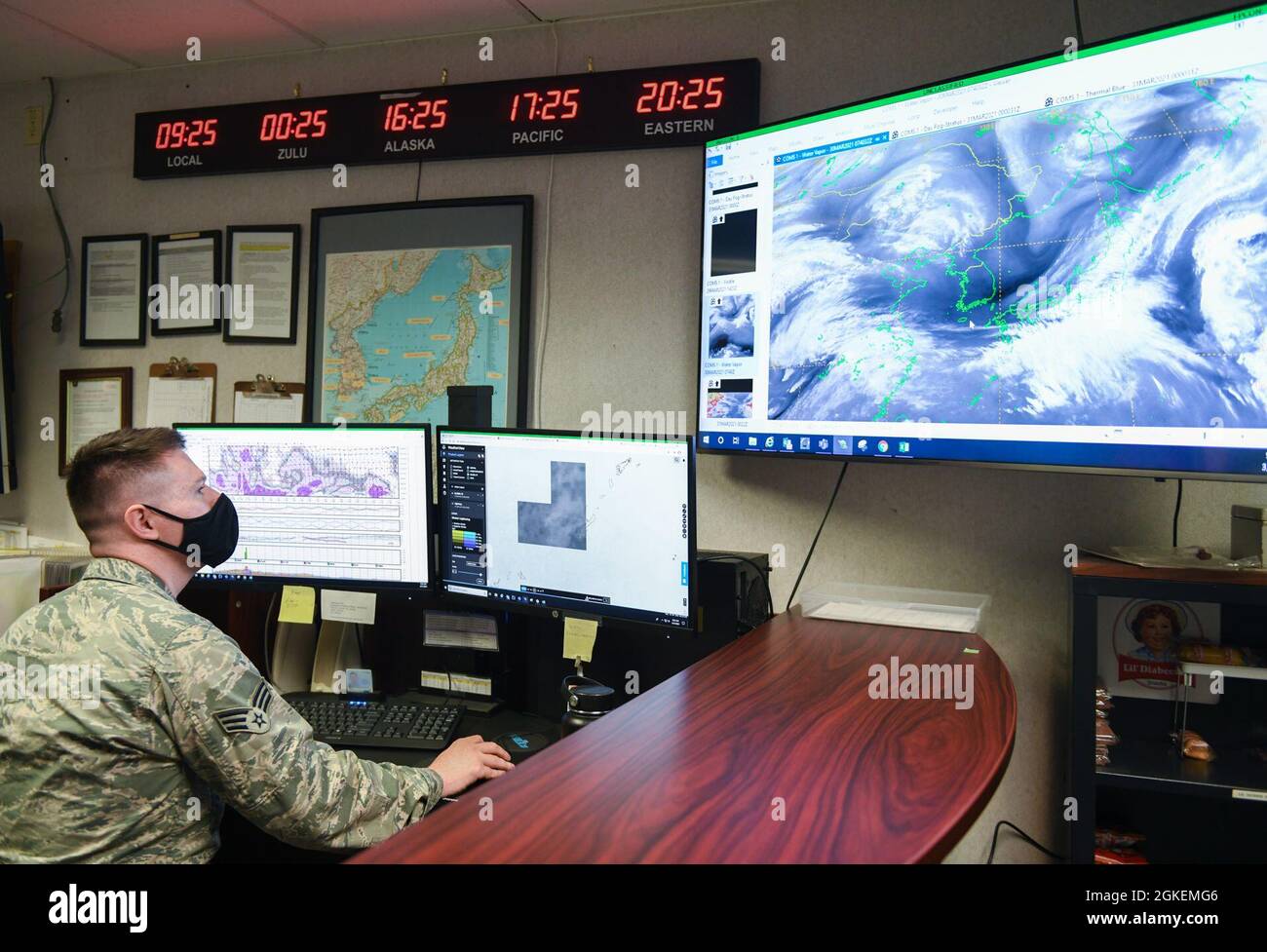 A U.S. Air Force weather forecaster from the 18th Operations Support ...