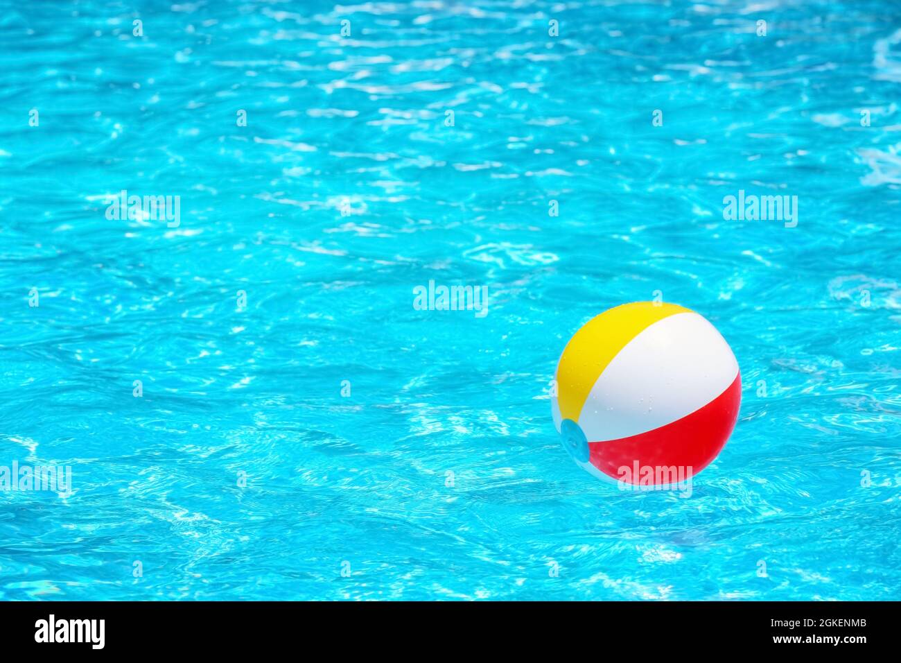 Colorful inflatable ball in blue swimming pool Stock Photo - Alamy