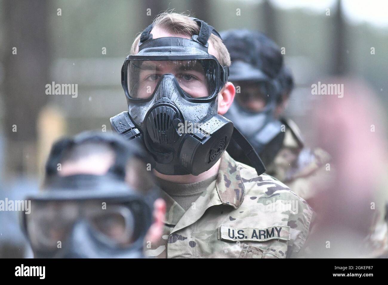 Soldiers of the 217th Military Police Detachment wait to enter the gas ...