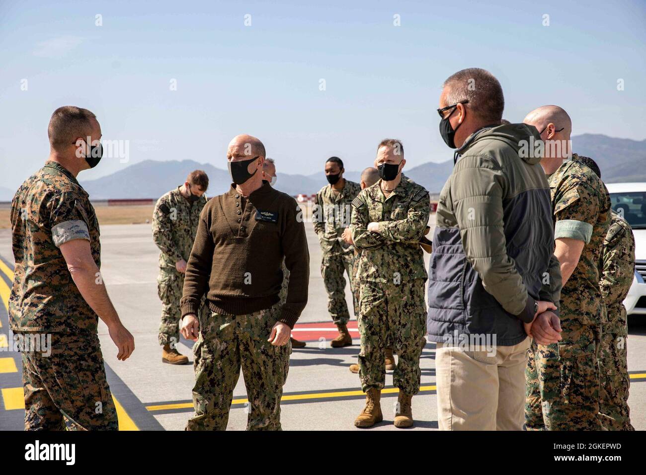 U.S. Navy Vice Admiral Bill Merz, center, commander of 7th Fleet, and ...