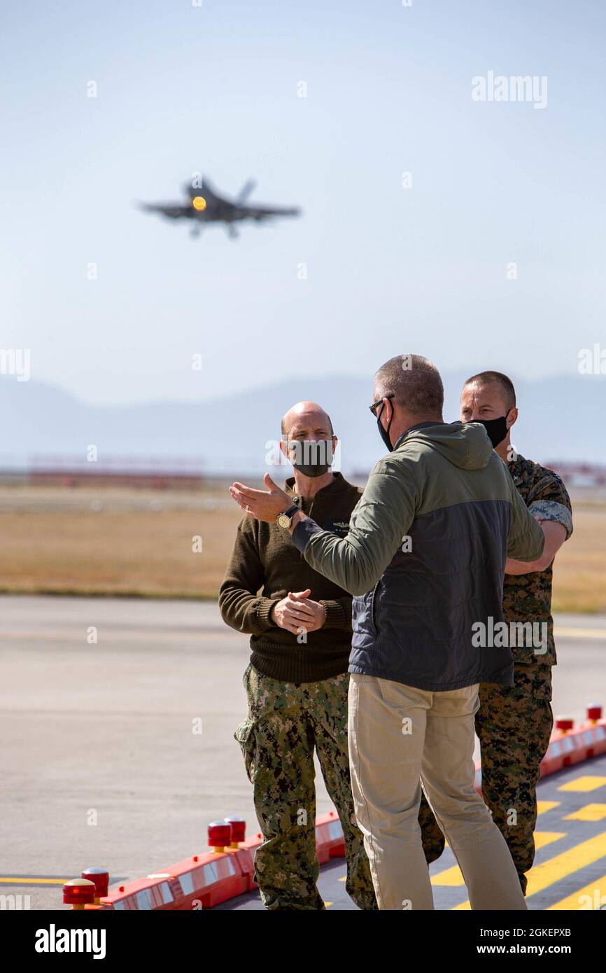 U.S. Navy Vice Admiral Bill Merz, center, commander of 7th Fleet, and ...