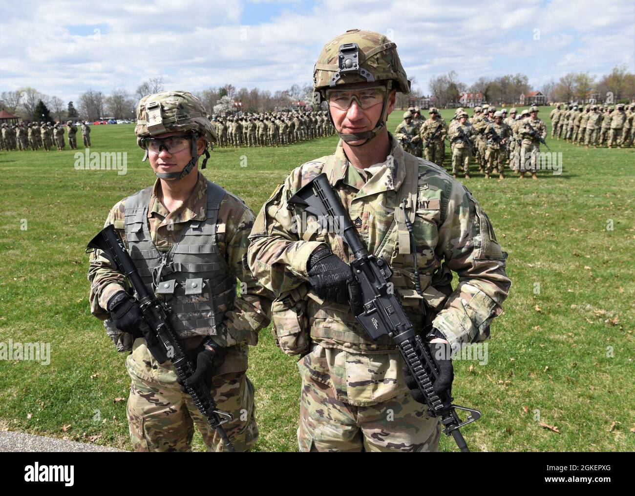Spc. James Spoerl of 1st Theater Sustainment Command (left) and Sgt ...