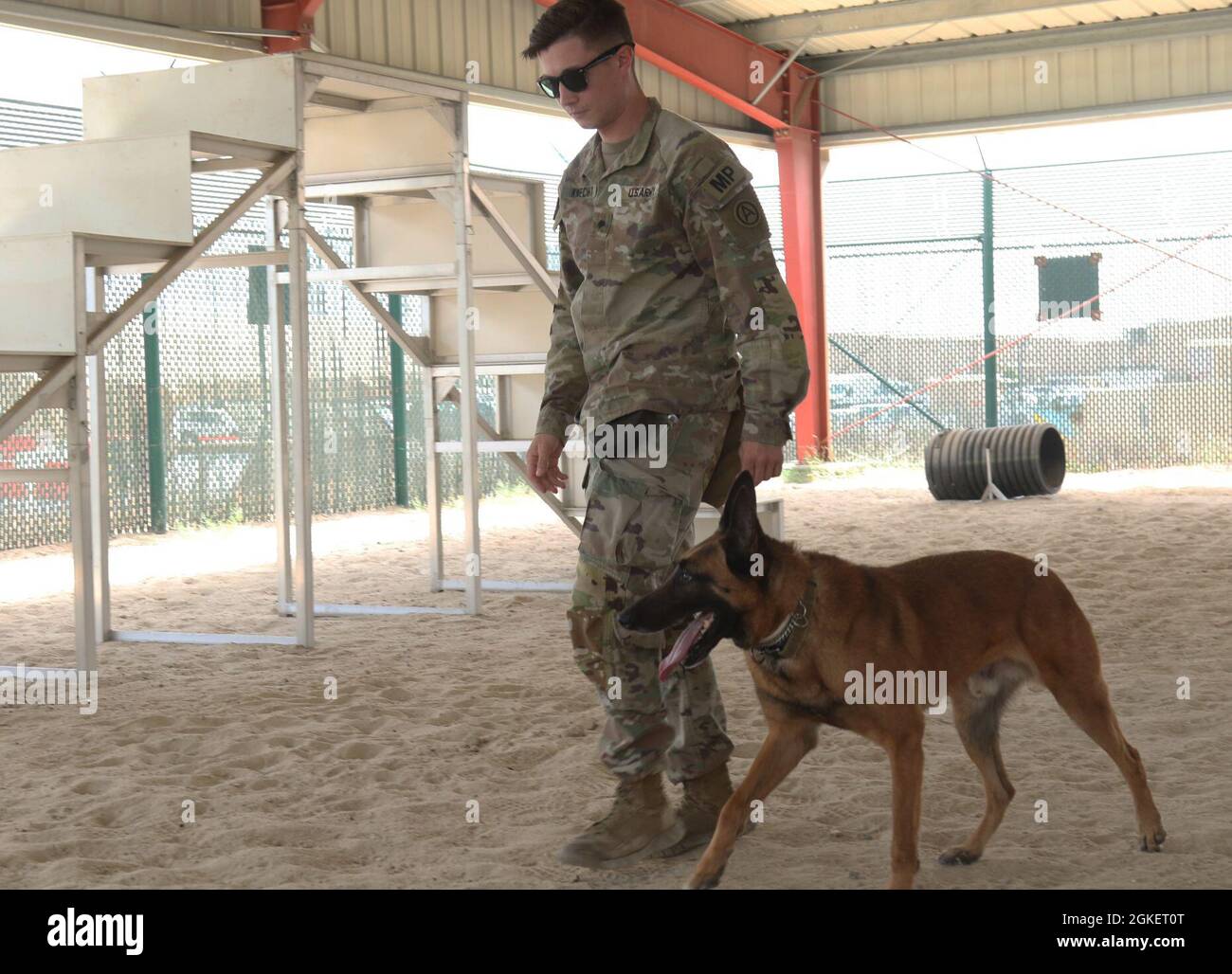 Spc. Kody Knecht, a dog handler from Area Support Group-Kuwait’s K-9 ...