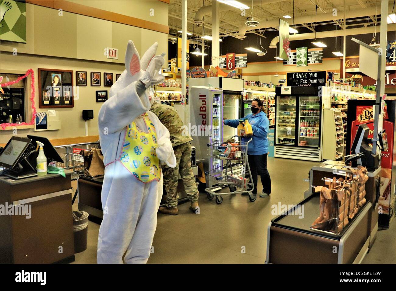 Store Associate Steve Gorshe, dressed as the Easter Bunny, waves to ...