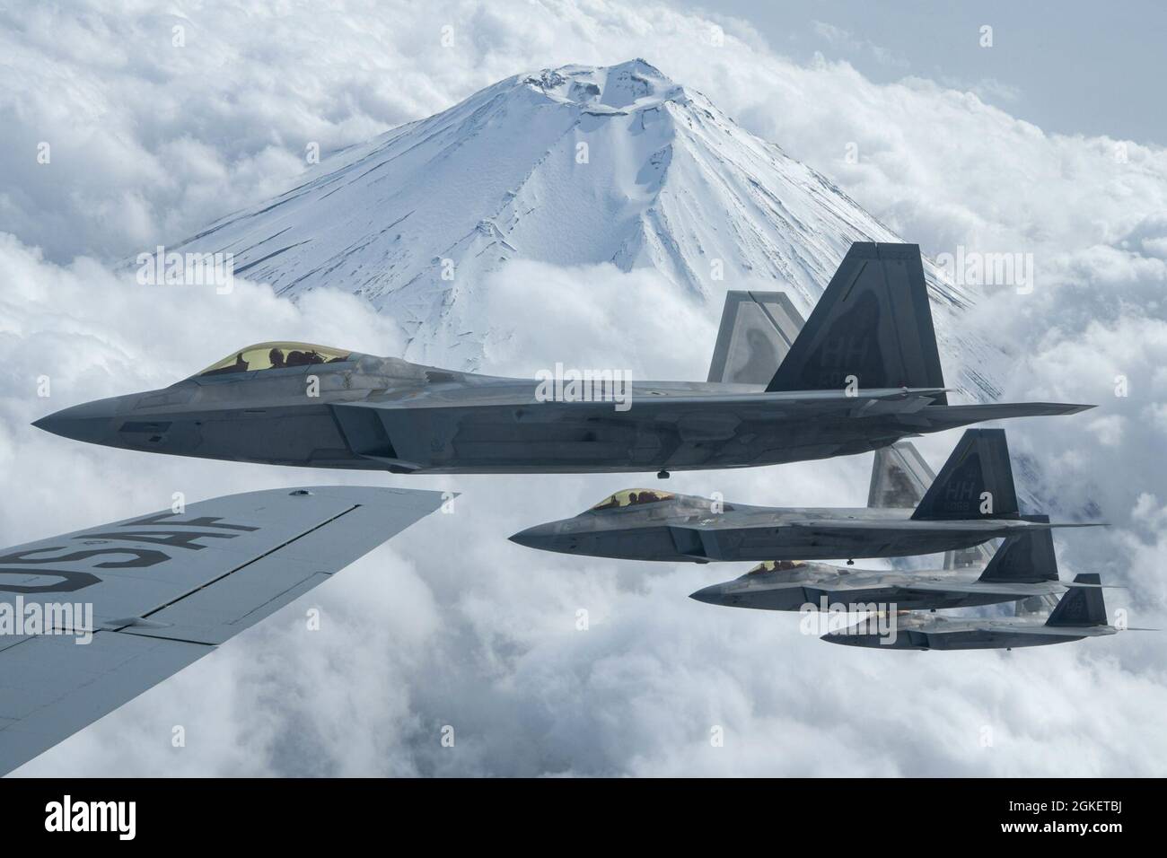 U.S Air Force Raptors from the 199th Fighter Squadron fly alongside a ...