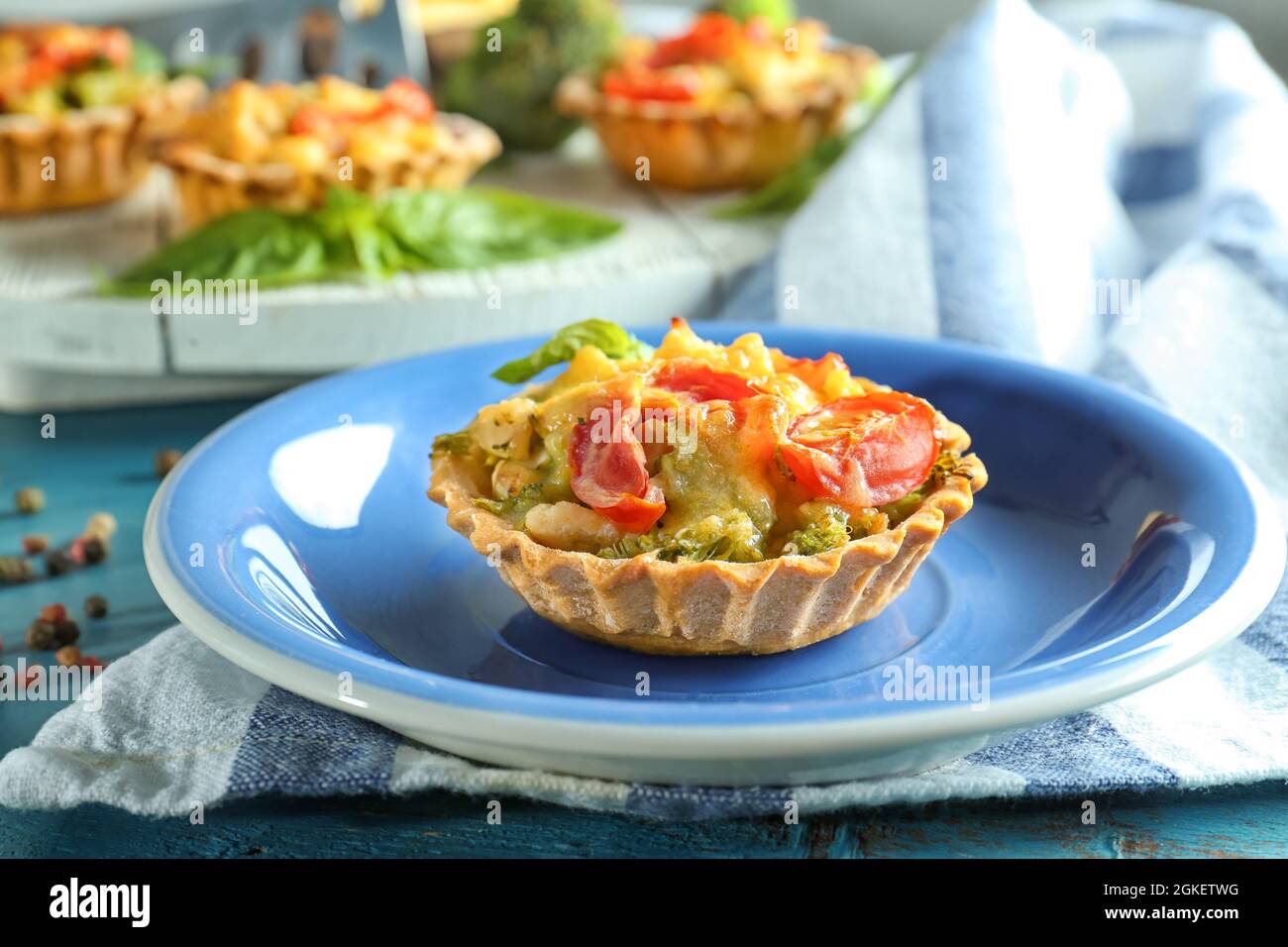 Delicious crispy tart with broccoli in plate Stock Photo - Alamy