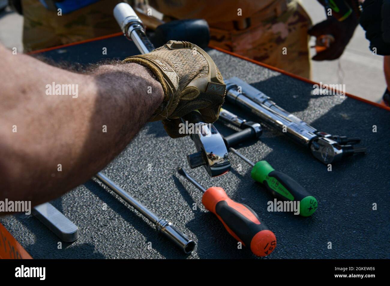 A 31st Munitions Squadron Airman picks up a tool during the inert Bomb ...