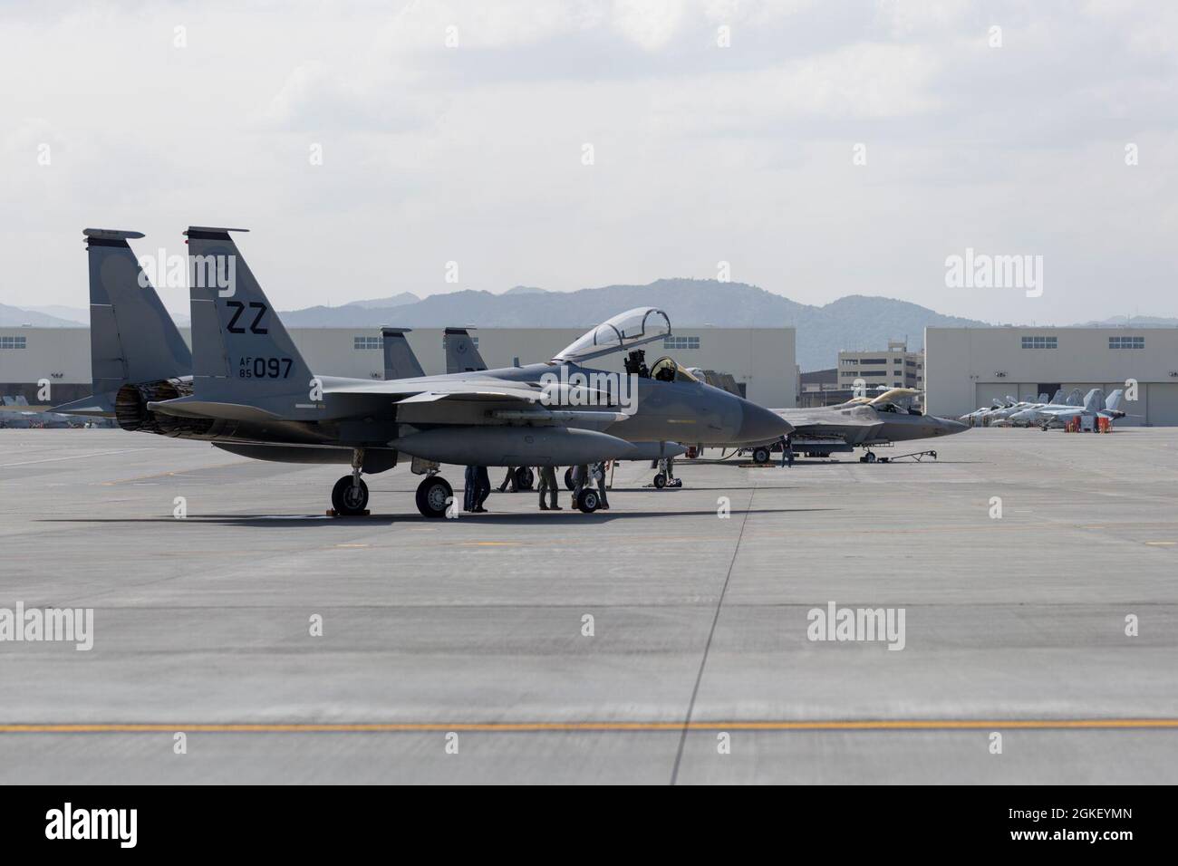 U.S. Air Force F-15C Eagle Aircraft with the 44th Fighter Squadron, left, F-22 Raptor aircraft ...