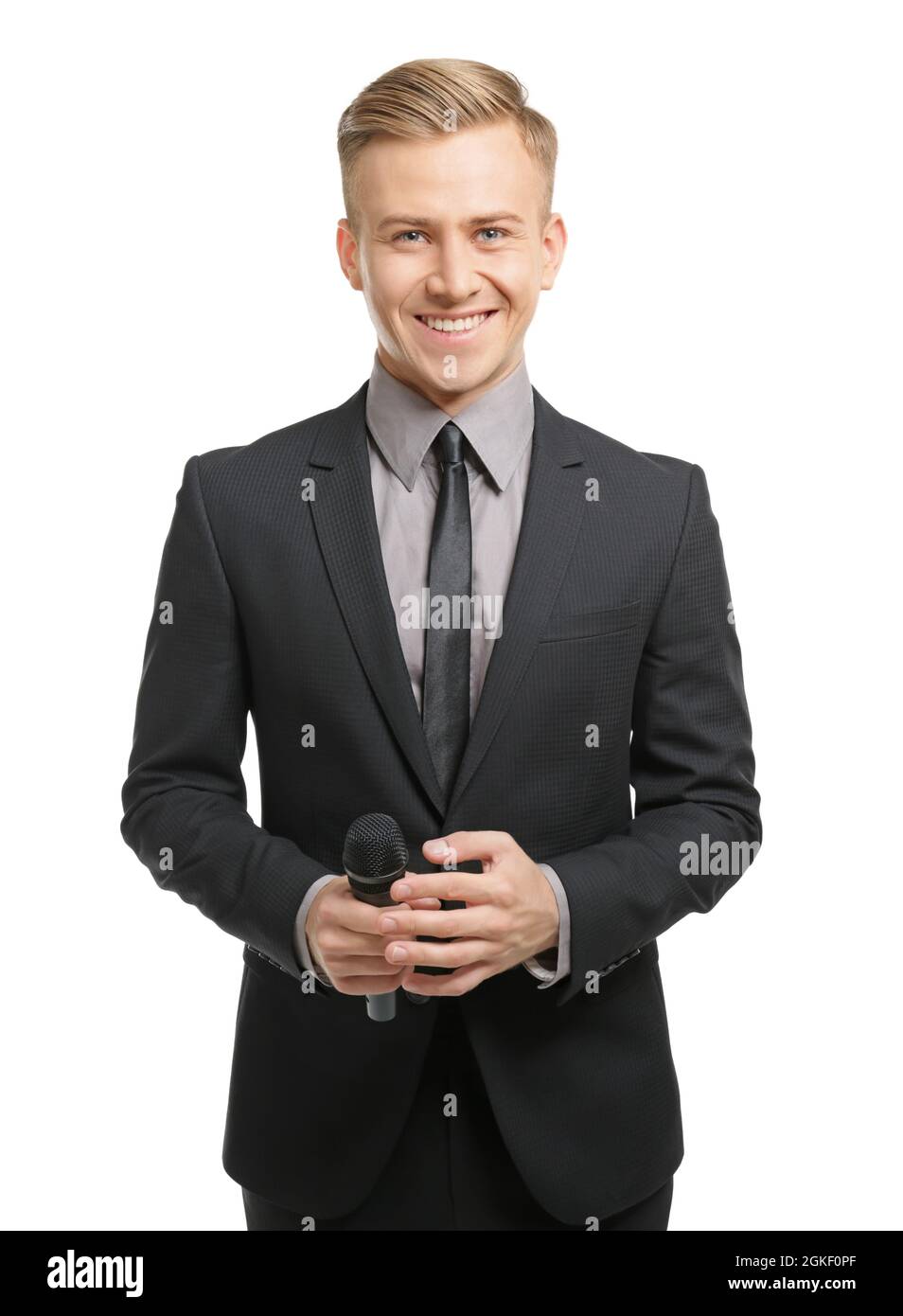 Young presenter with microphone on white background Stock Photo - Alamy