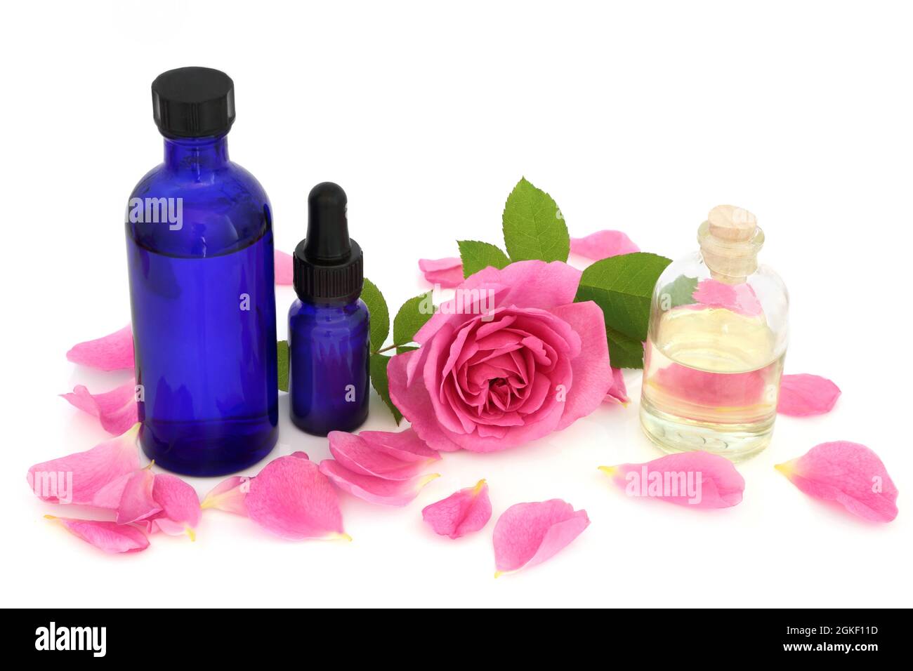 Rose water, aromatherapy essential oil bottle, pink rose and flower ...