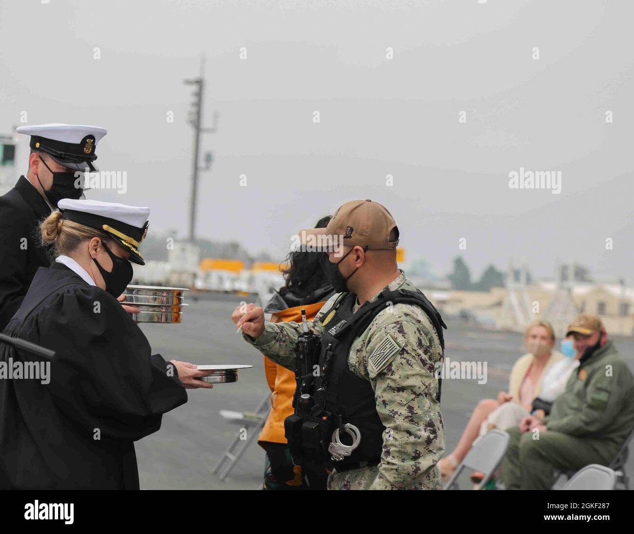 SAN DIEGO (April 4, 2021) Master-at-Arms partakes of communion during ...