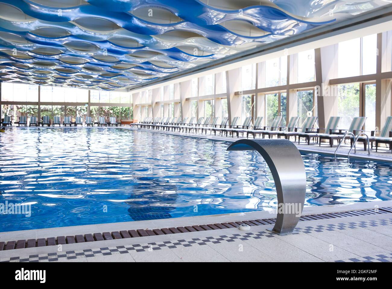 Indoor swimming pool in modern hotel Stock Photo - Alamy
